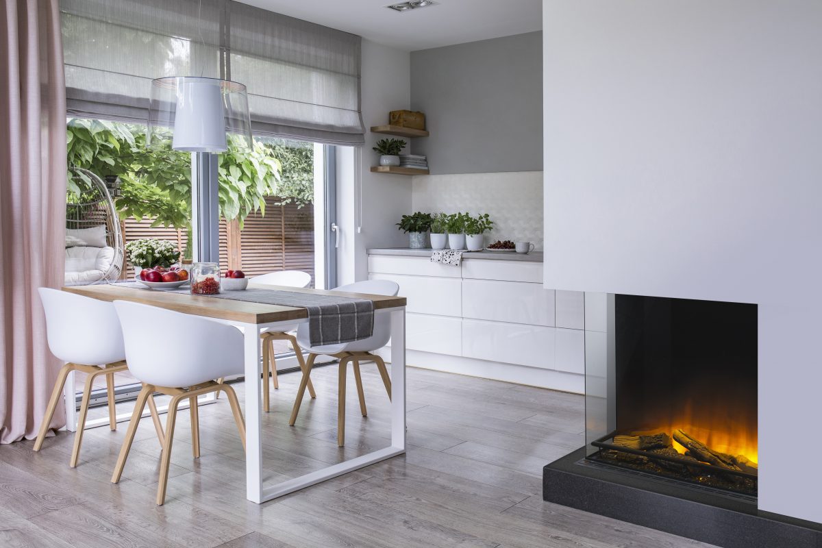 Real photo of a dining table, chairs and kitchen interior. Storage for ...